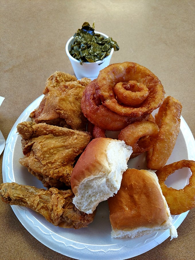A plate that screams "America!" &ndash; fried chicken, onion rings, and a roll, with sides that would make your cardiologist wince but your soul sing. 