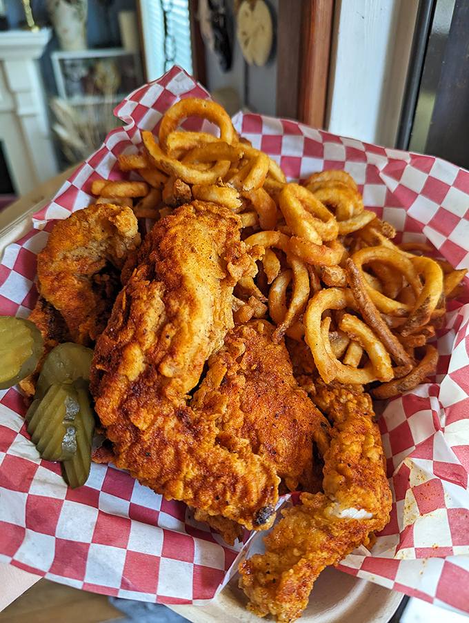 Crispy, spicy chicken meets curly fries in a basket of pure joy. The pickle provides that perfect acidic counterpoint to all that glorious richness.