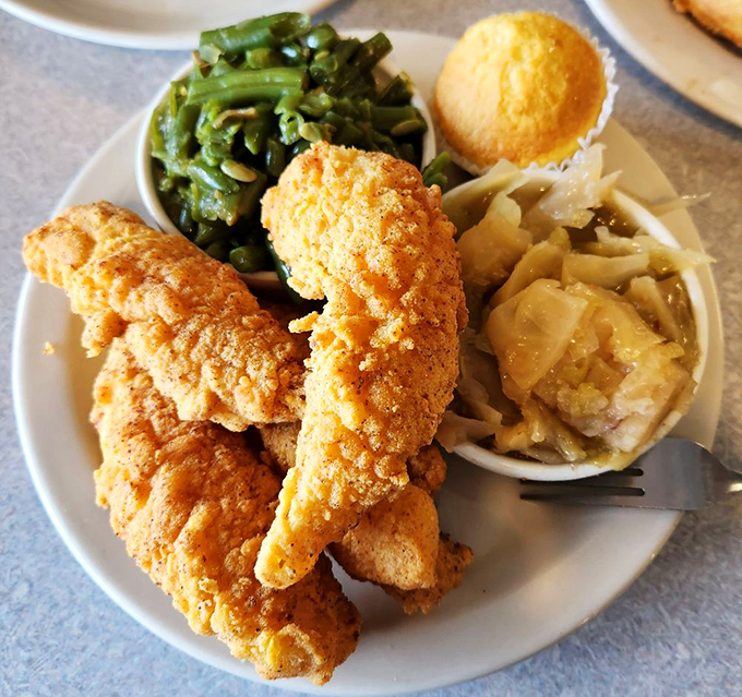 This plate is singing a three-part harmony of textures—crispy chicken, tender green beans, and what appears to be the mac and cheese of my dreams.