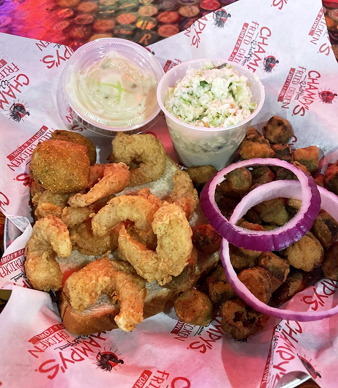 Fried shrimp nestled against crispy okra with purple onion rings standing guard. This basket of Southern treasures demands your full attention.