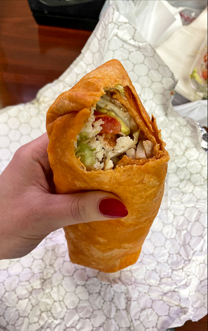 The wrap offers a portable flavor explosion &ndash; all the goodness of their signature fillings tucked into a tomato basil blanket of deliciousness.