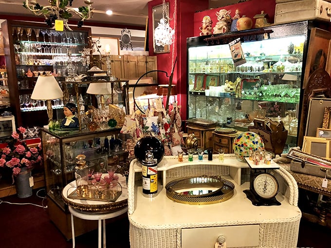 Crystal, glass, and whimsy arranged like a still life from another era. That wicker vanity has definitely seen some stories.