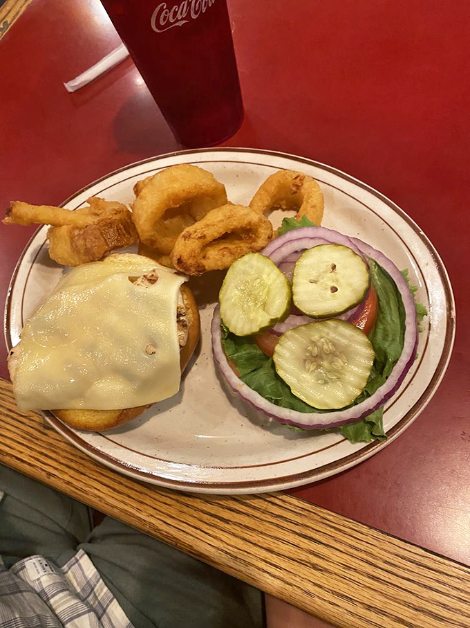 Saut&eacute;ed zucchini and onions share the plate with a cheese-blanketed chicken-fried steak &ndash; proof that vegetables and indulgence can coexist peacefully. 