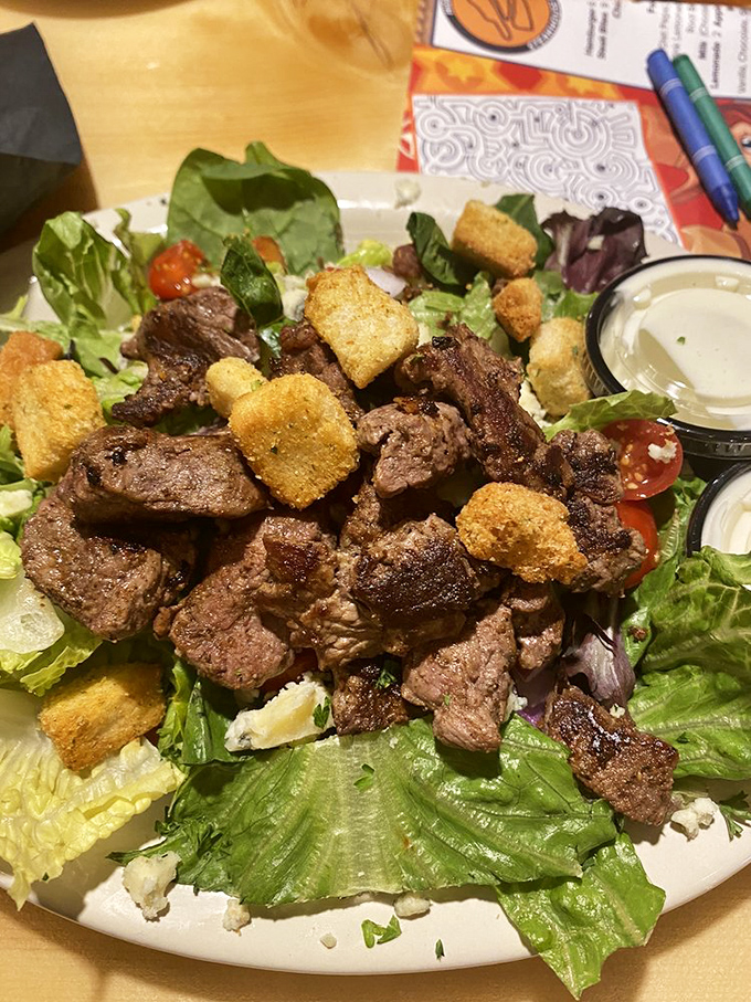 The Hideout Steak Salad&mdash;where lettuce finally gets the respect it deserves by mingling with perfectly seared beef and golden croutons.