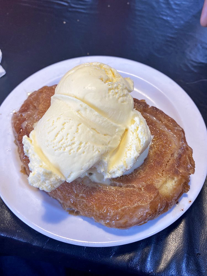 Dessert nirvana achieved! A warm honey bun crowned with cool, creamy ice cream creates the sweet finale your taste buds didn't know they needed.