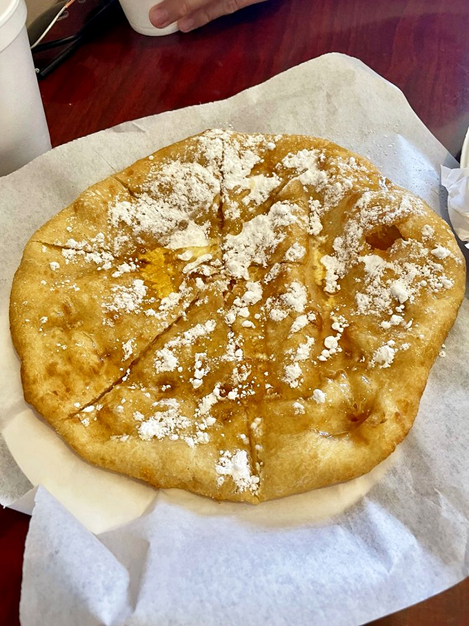 Honey drizzled over hot fry bread with a dusting of powdered sugar. Dessert simplicity that would make your grandmother weep with pride.