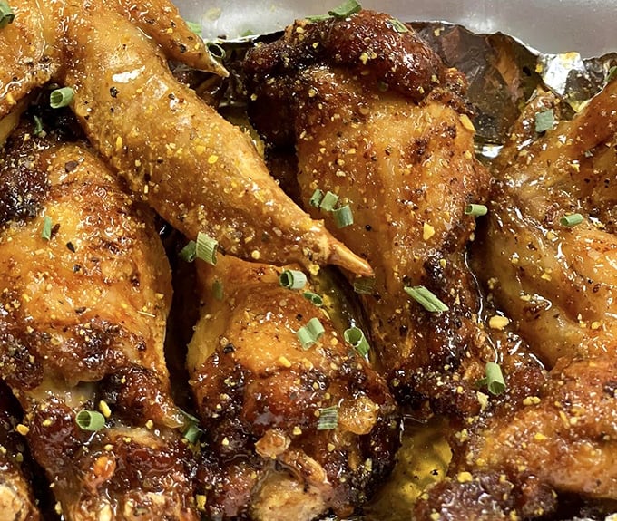 These lemon pepper wings aren't just garnished with green onions &ndash; they're elevated to poultry perfection with seasoning that means business.