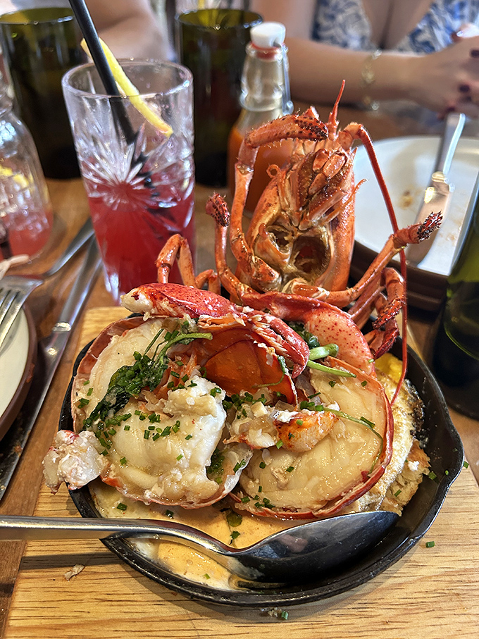 This isn't just lobster – it's a crustacean celebration in a cast iron skillet. The kind of dish that makes you temporarily forget your table manners.