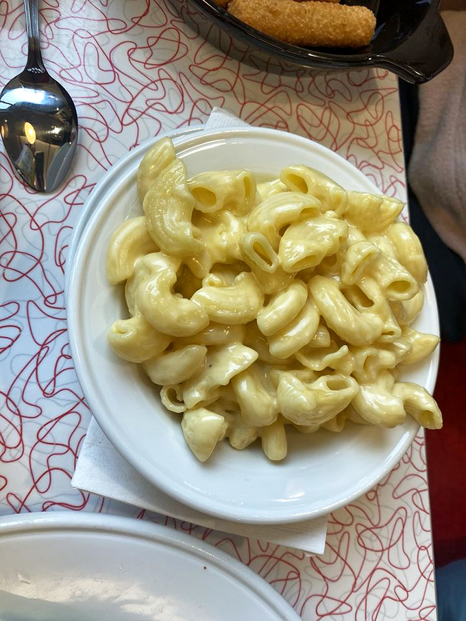 Mac and cheese so creamy it should require a lifeguard on duty. This isn't just comfort food&mdash;it's a warm hug for your soul.
