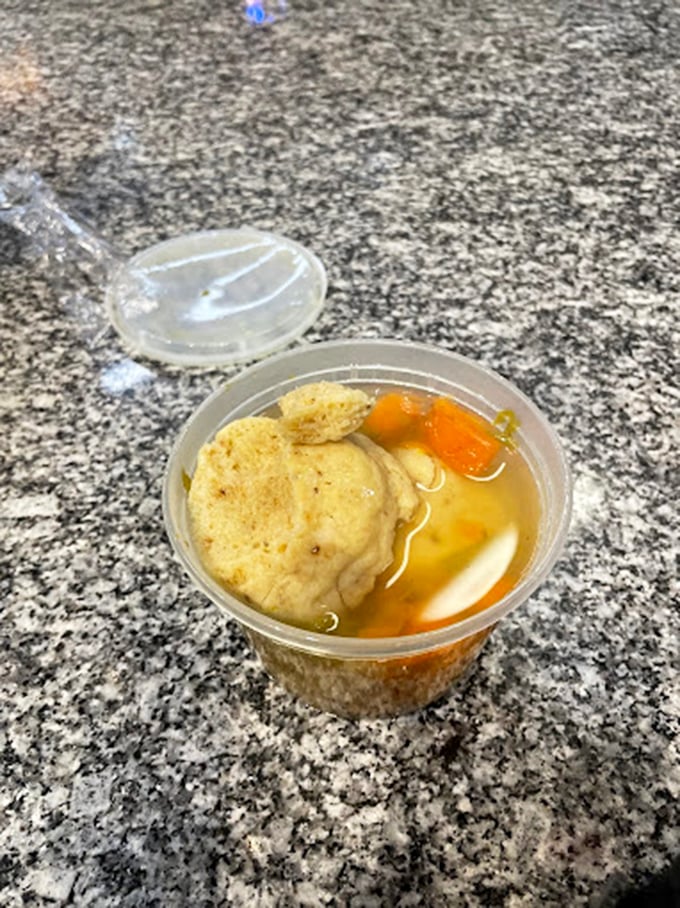 The humble matzo ball, surrounded by golden broth and vegetables, proves that simplicity often delivers the most profound satisfaction.