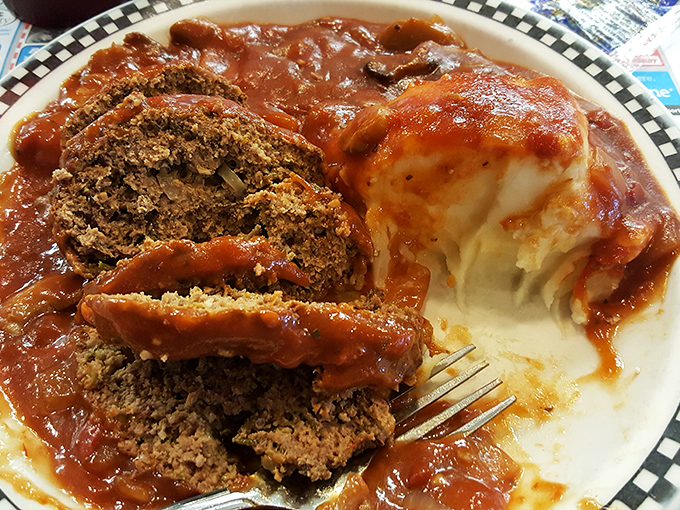 Meatloaf and mashed potatoes&mdash;the Batman and Robin of diner cuisine. This plate isn't just food; it's a time machine to simpler days.