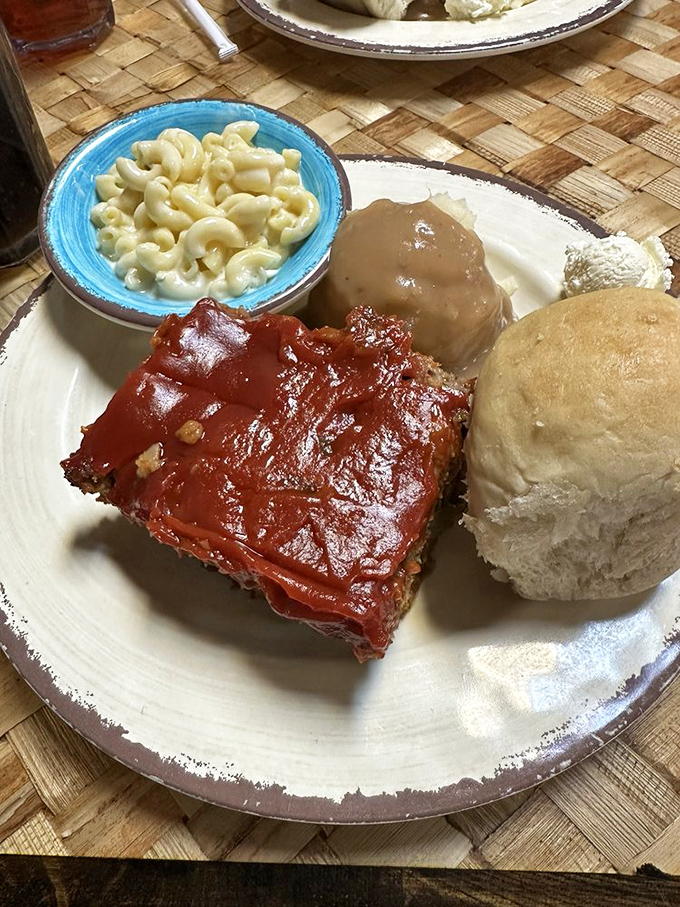 Meatloaf glazed with tangy sauce, alongside homestyle sides and a fresh roll &ndash; nostalgia you can eat without calling your mother first.