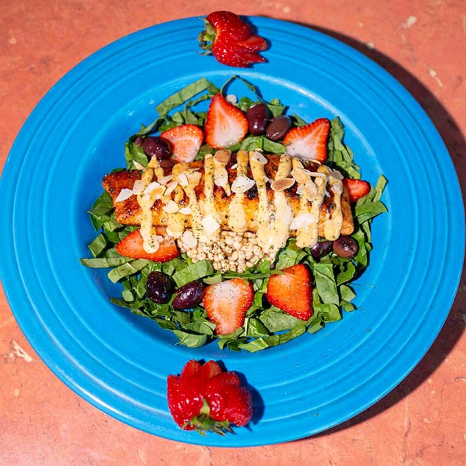 A salad that makes eating greens feel like cheating on your diet. Those strawberries and grilled chicken are having a party, and you're invited.