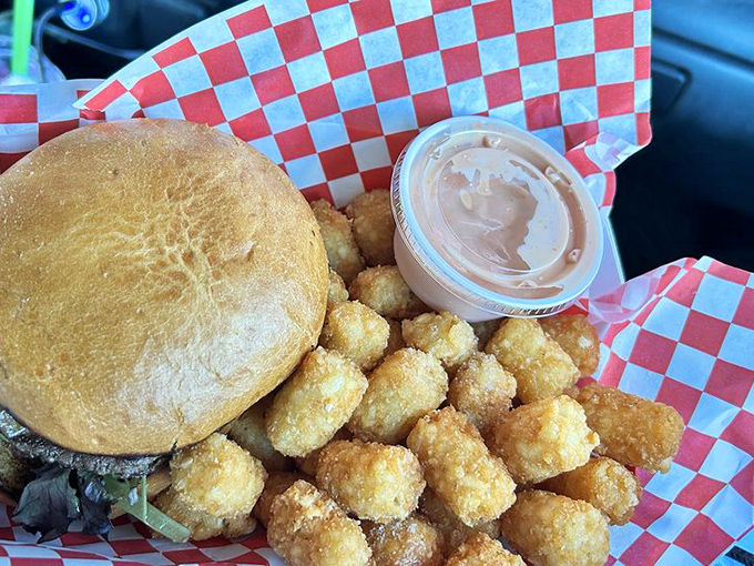 The Mushroom Swiss burger with tots&mdash;a combination so perfect it makes you wonder why we bother with fancy restaurants at all.