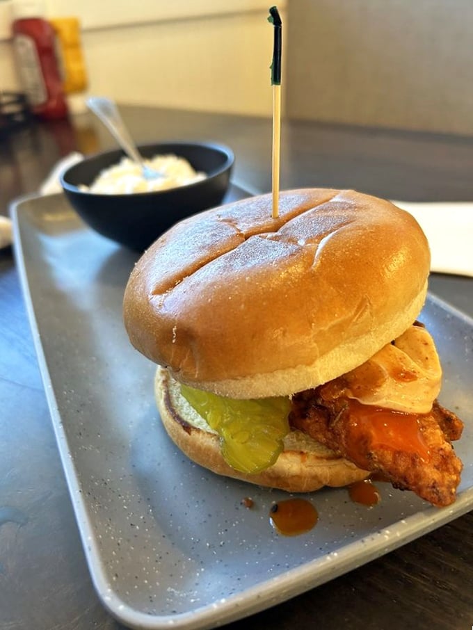 This Nashville Hot Chicken sandwich brings Tennessee heat to Iowa plates. Those pickles aren't just garnish &ndash; they're essential cooling agents for the brave.