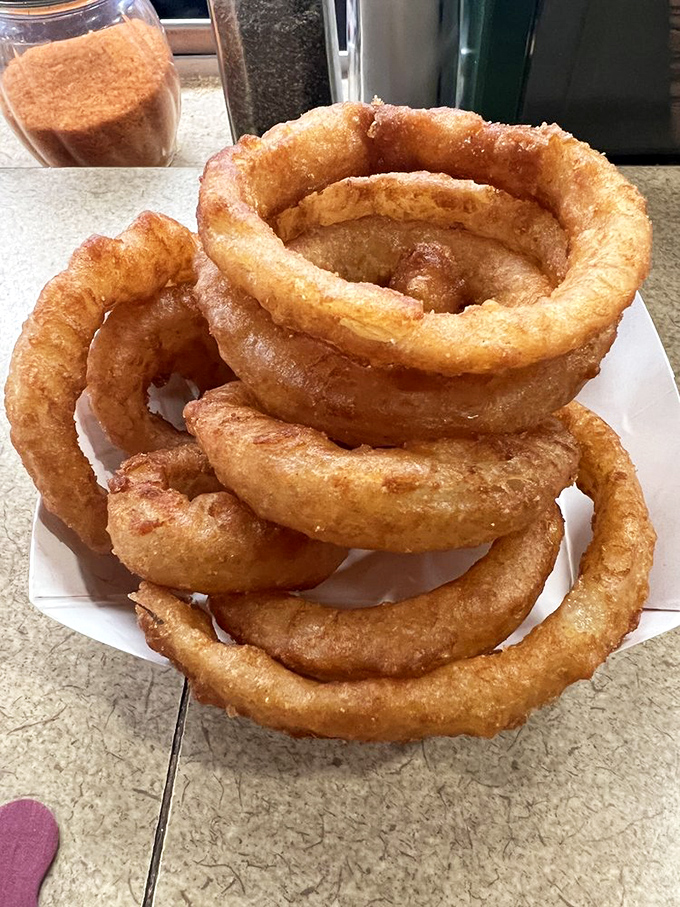 These onion rings aren't just fried&mdash;they're transformed into golden halos of crunch that would make angels jealous.