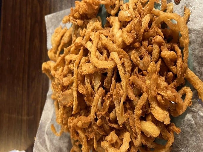 Onion rings so crispy they deserve their own fan club. These golden halos aren't just a side dish&mdash;they're a religious experience for the taste buds.