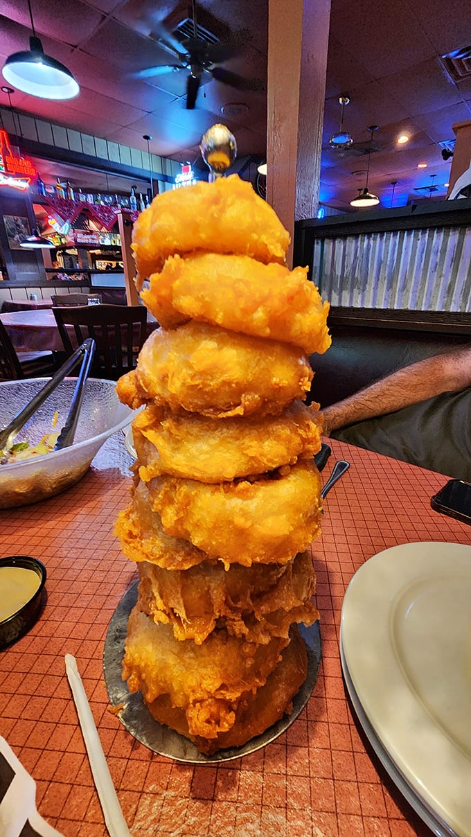 The onion ring tower isn't just food&mdash;it's architecture. Frank Lloyd Wright would approve of this golden, crispy structure.