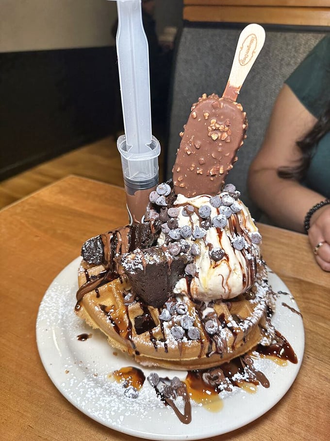 Not breakfast, not dessert, but something gloriously in-between. This ice cream-topped waffle with chocolate bar garnish laughs in the face of conventional meal boundaries.