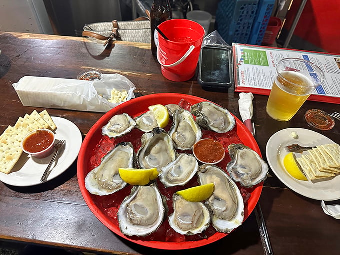 Fresh oysters served unpretentiously on a red plastic tray. Sometimes paradise comes with cocktail sauce and a squeeze of lemon.
