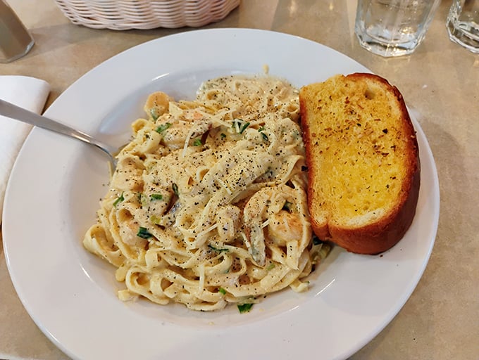 Fettuccine that would make an Italian grandmother nod in approval, with garlic bread ready to mop up every last drop of sauce.
