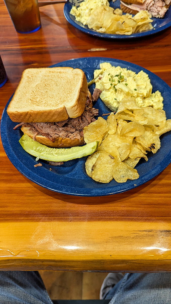 The humble pulled pork sandwich—a masterpiece of simplicity that proves sometimes the best things in life come between two slices of toast.
