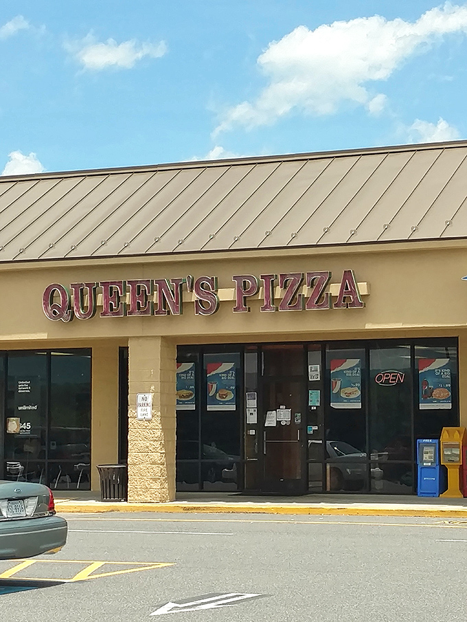 Queen's Pizza stands ready to serve, with mountains framing the view&mdash;because even pepperoni deserves a majestic backdrop.