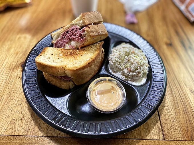 A proper Reuben should require both hands and several napkins. This beauty delivers on both counts, with coleslaw as the perfect sidekick.