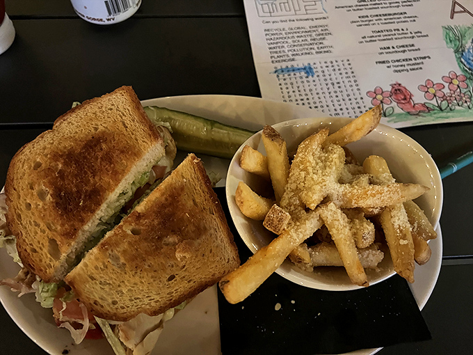 This sandwich isn't just cut in half; it's displaying its inner soul. The pickle stands guard like a sentinel protecting flavor country.