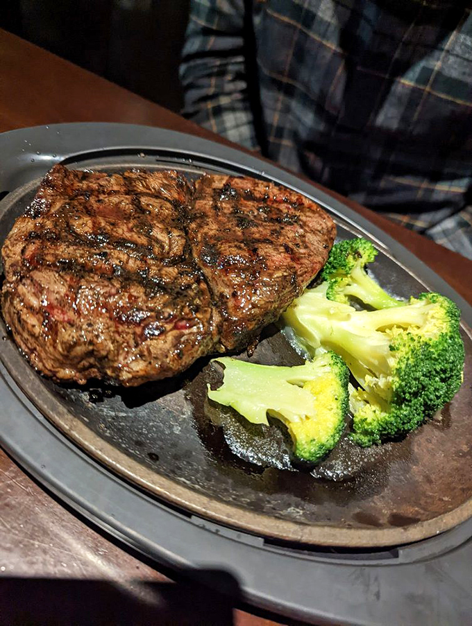 This ribeye has the kind of char marks that deserve their own Instagram account. Broccoli's just there to ease your conscience.