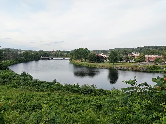 The Quinebaug River curves gracefully through town, a liquid timeline connecting Putnam's mill town past with its reinvented present.