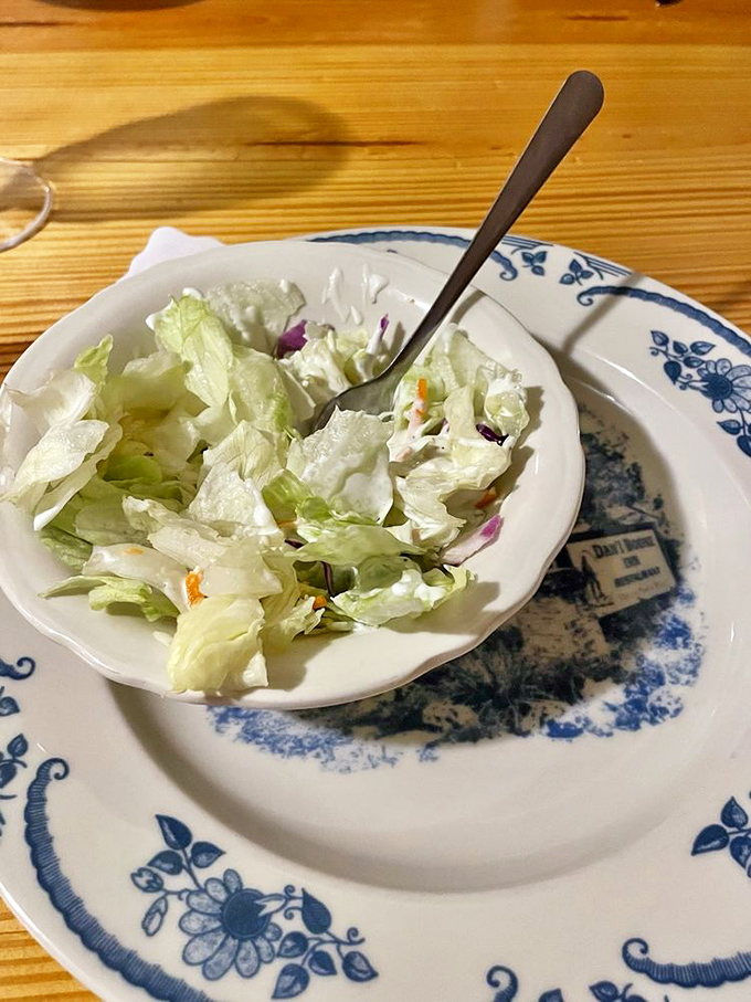 Even the simple side salad gets the respect it deserves, served on distinctive china that honors the restaurant's historical roots.