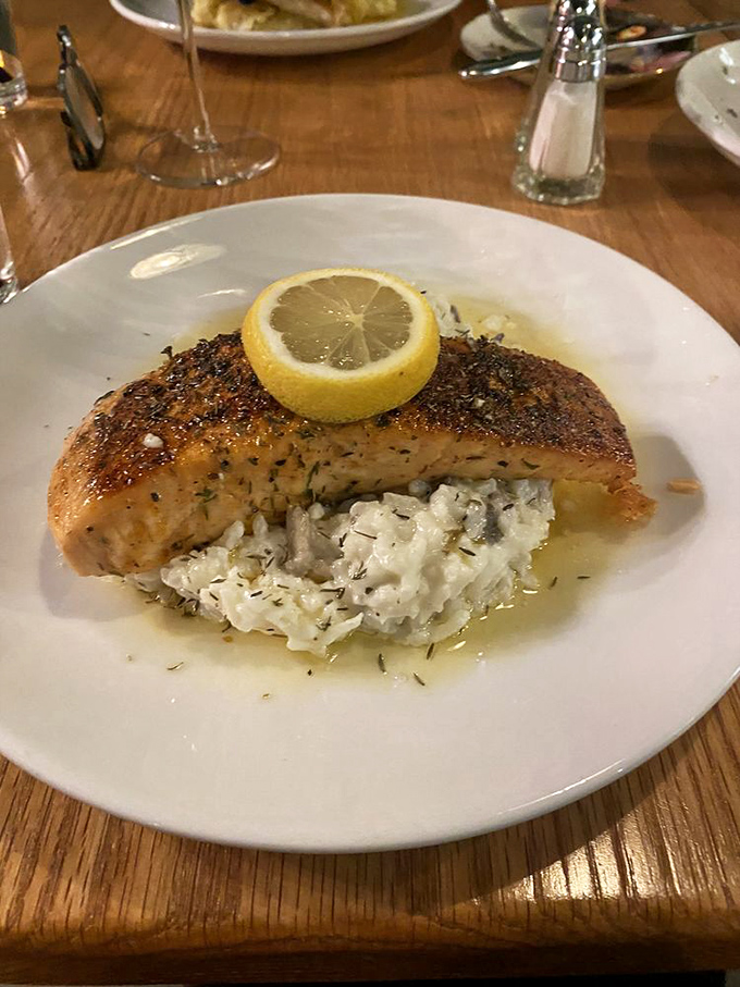 This salmon filet, perfectly seared and perched atop creamy risotto, proves that simplicity done right can outshine the fanciest culinary gymnastics.