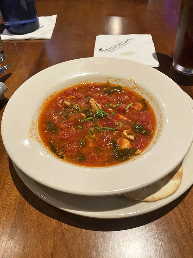 This isn't just soup &ndash; it's a warm hug in a bowl, where tomatoes, herbs and seafood have gathered for the world's most delicious meeting.