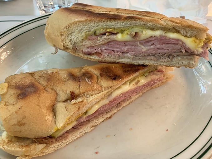 Cross-section perfection reveals the sandwich's inner secrets&mdash;like a delicious geology lesson where every layer tells a story of flavor.