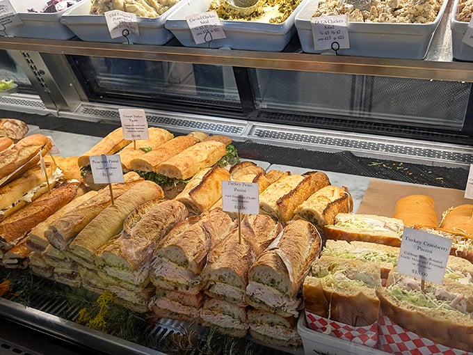The sandwich display case&mdash;where dreams are born and diets go to die. Each creation more tempting than the last, like a deli version of The Bachelor.