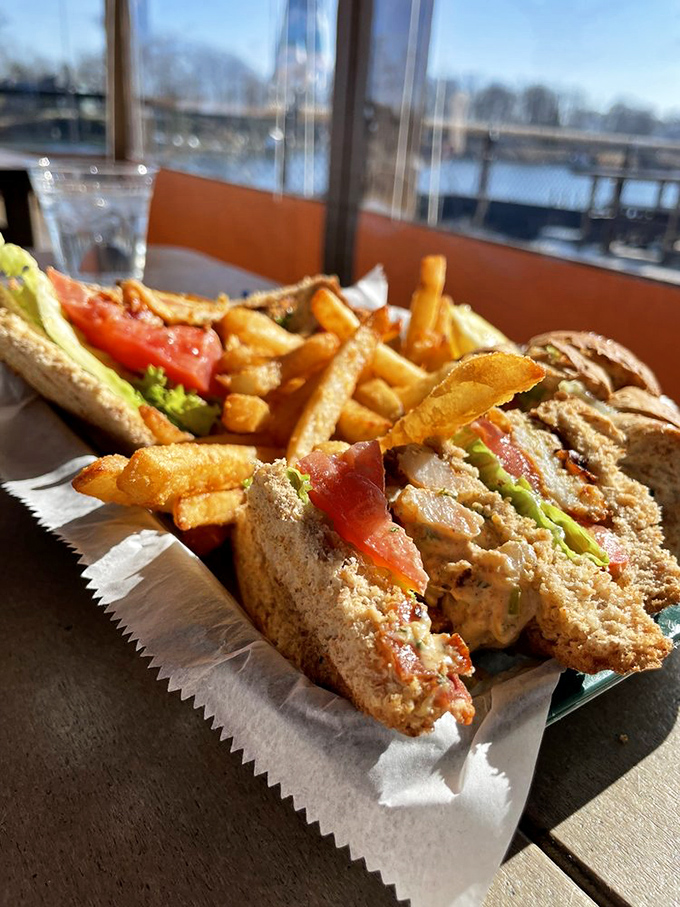 This isn't just a sandwich&mdash;it's architecture. Layers of crab cake, fresh vegetables, and toasted bread create the skyscraper of seafood sandwiches.