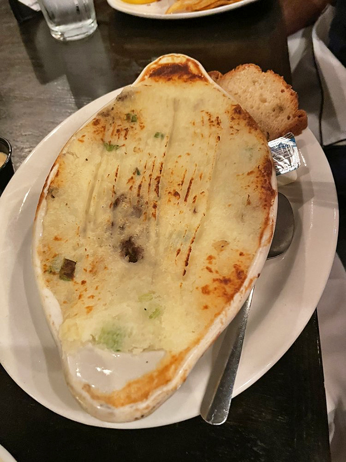 Look at those visible chunks of meat and vegetables peeking through the potato blanket&mdash;this isn't fast food, it's slow food worth waiting for.