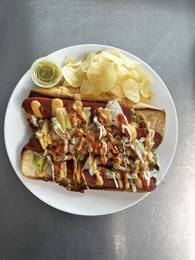 The Schuco Dirty Hot Dog laughs in the face of ordinary franks, dressed to impress with guacamole, cabbage, and a trio of sauces.