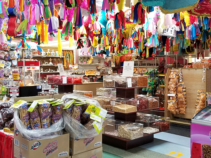 A kaleidoscope of colorful treats under festive streamers&mdash;where bulk candy and snacks prove that happiness can, in fact, be bought by the pound.