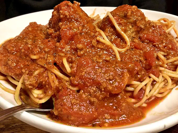 These meatballs aren't just good; they're "call-your-mother-and-apologize-for-saying-hers-were-the-best" good. Swimming in rich, rustic sauce atop al dente spaghetti.