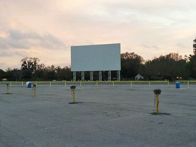 An empty lot waiting for the evening's cinematic adventure. Those yellow posts aren't decorative – they're the modern equivalent of the classic speaker poles.