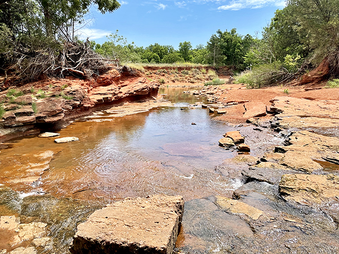 Oklahoma's distinctive red earth tells geological stories centuries in the making. This rocky streambed reveals the state's ancient character.