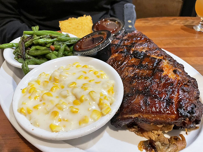A half slab of ribs with creamy corn and crisp slaw—the holy trinity of barbecue that makes you wonder why you ever eat anything else.