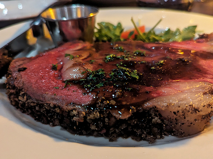 The crust on this steak isn't burned—it's a flavor force field, protecting the perfectly pink interior until your knife breaks the seal.