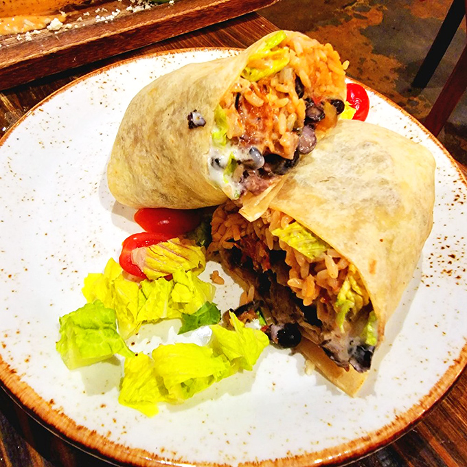 This burrito doesn't just blur the line between land and sea—it erases it completely in a hand-held fiesta of flavors.