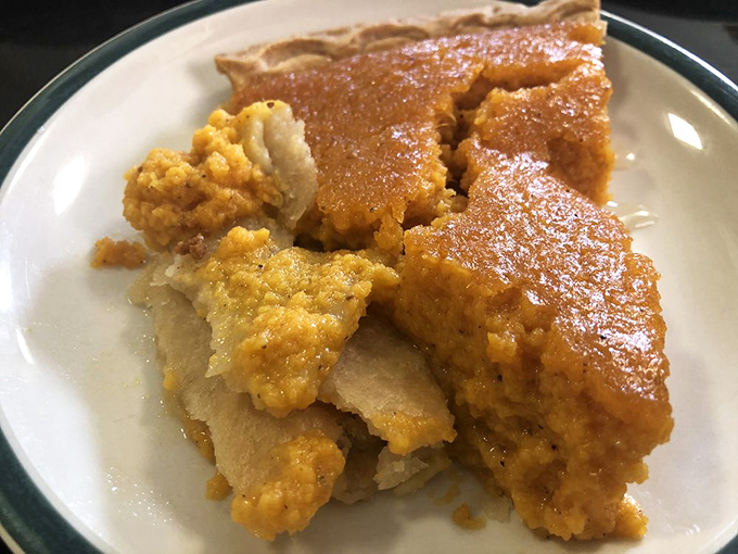 A pecan pie so perfectly arranged it looks like each pecan personally volunteered for the honor of being part of this masterpiece. 