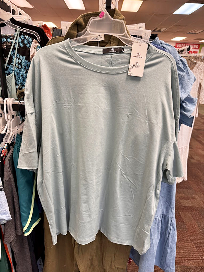 Fashion finds hang alongside practical treasures. This simple tee could become your next favorite wardrobe staple or vacation essential.