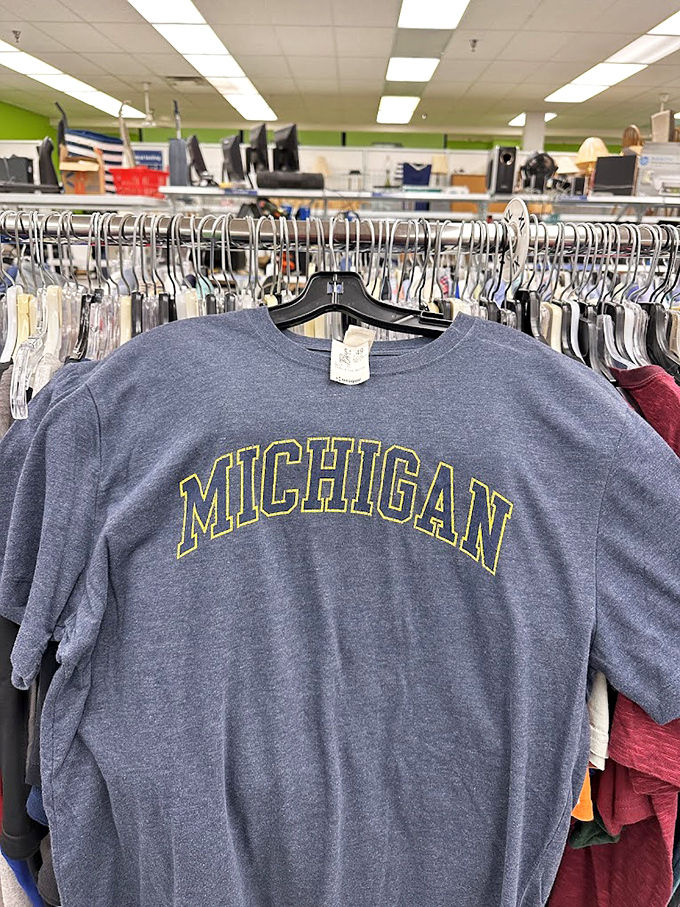 Someone's collegiate pride becomes another's vintage score. This Michigan sweatshirt carries memories of tailgates past while awaiting its next gameday adventure.