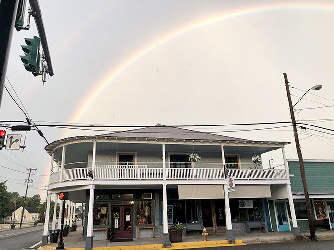 A perfect rainbow arches over historic downtown Breaux Bridge, nature's way of highlighting where culinary gold truly lives.